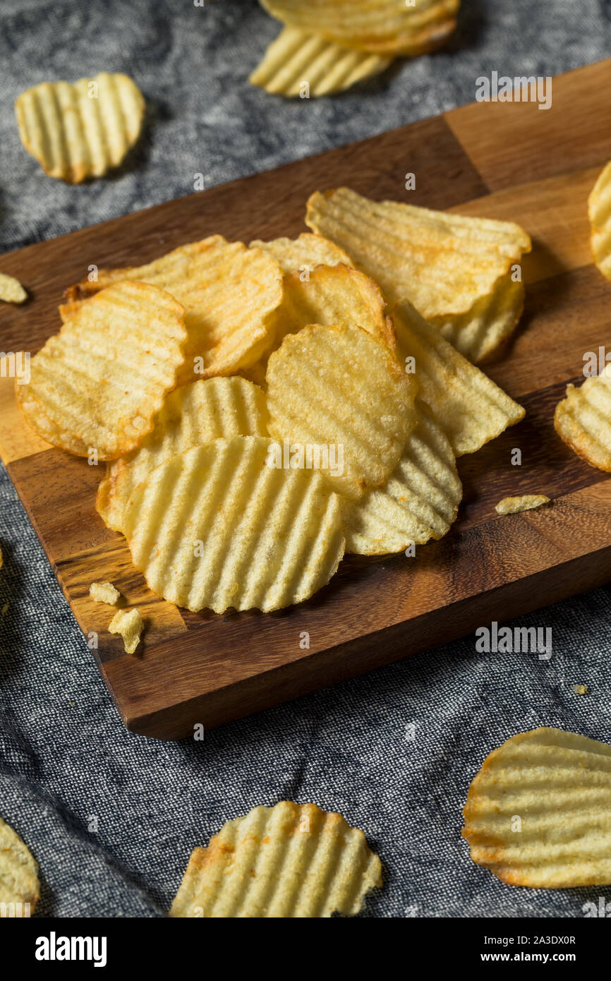 Organic Salted Wavy Potato Chips Ready to Eat Stock Photo - Alamy