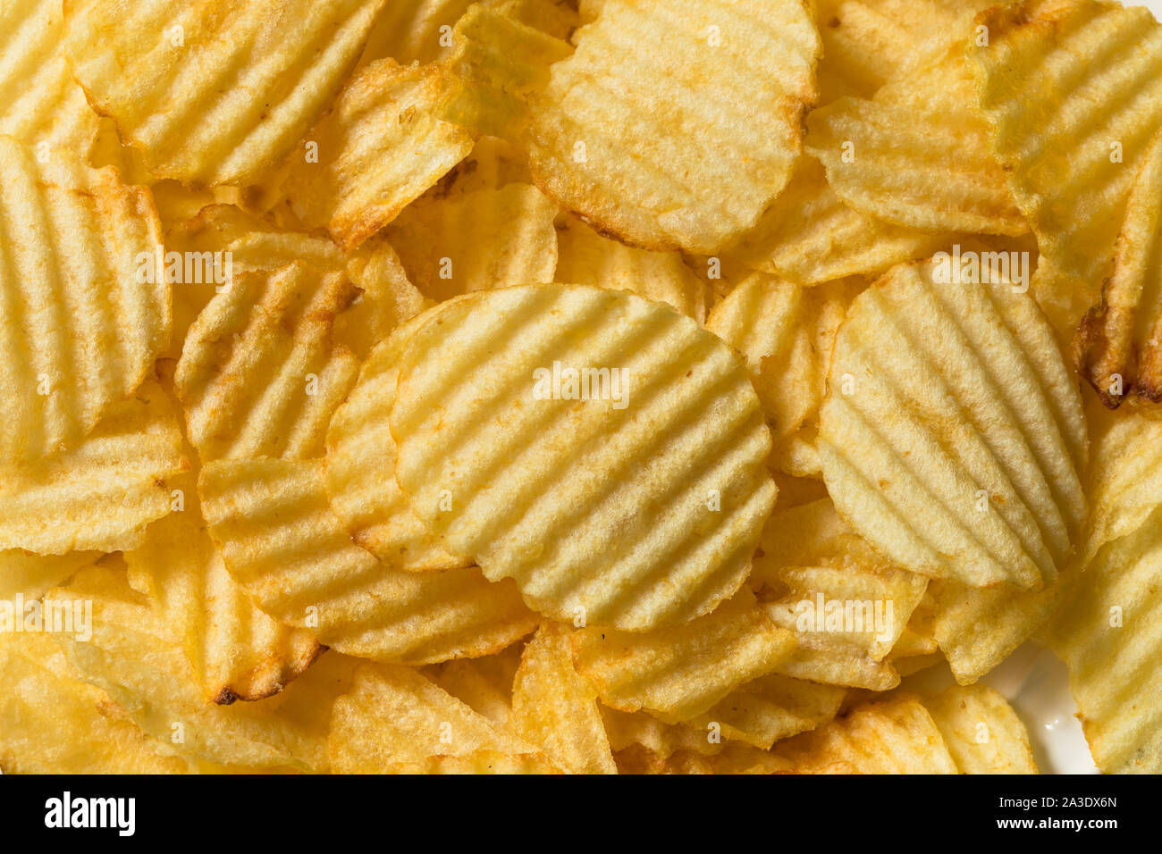 Organic Salted Wavy Potato Chips Ready to Eat Stock Photo - Alamy