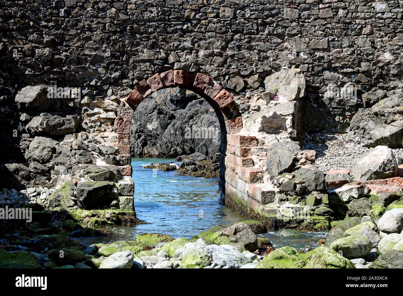 Archway in sea wall at Portpatrick harbour Scotland Stock Photo - Alamy