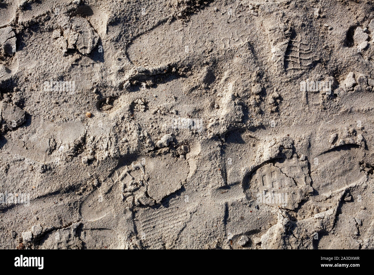 Many different footprints on yellow sand at summer sunny day Stock ...