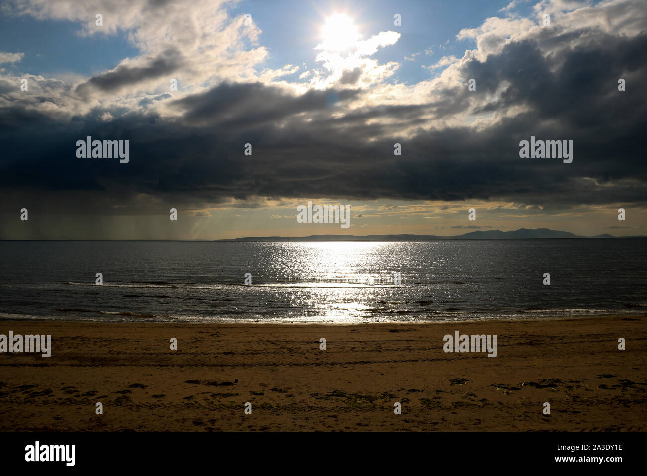 Afternoon rainstorm at a coastal beach location Stock Photo - Alamy