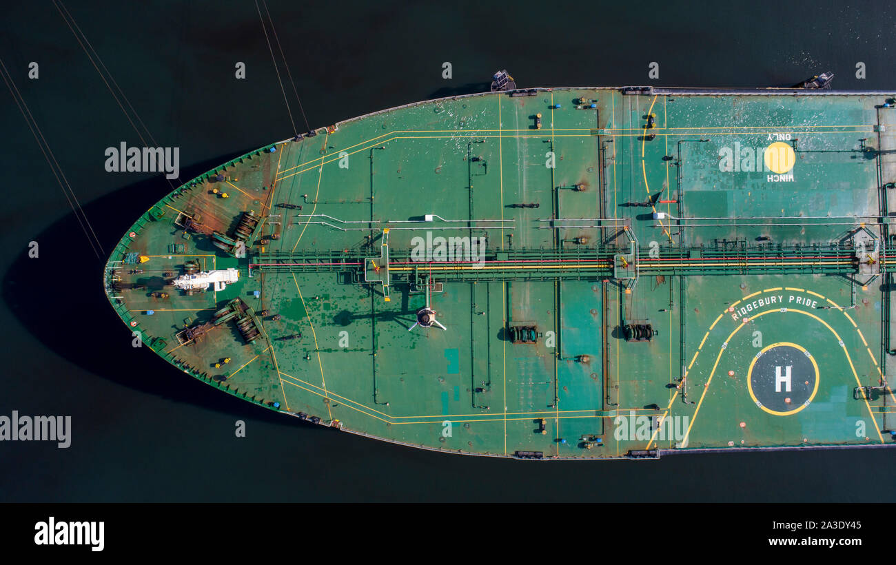Aerial view oil tanker ship at the port, import export business ...