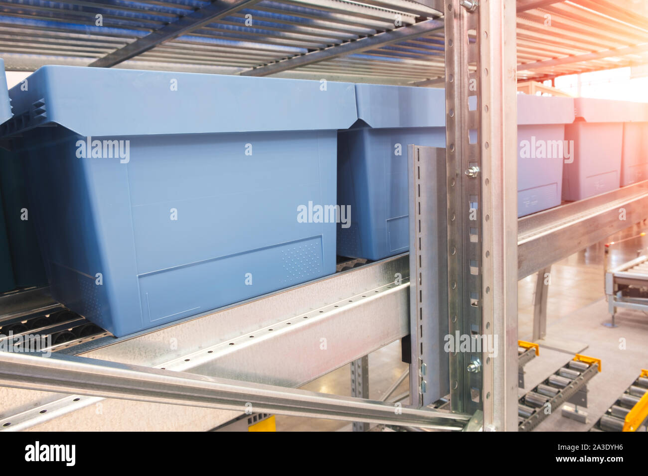 Automated storage warehouse with blue plastic crates Stock Photo - Alamy