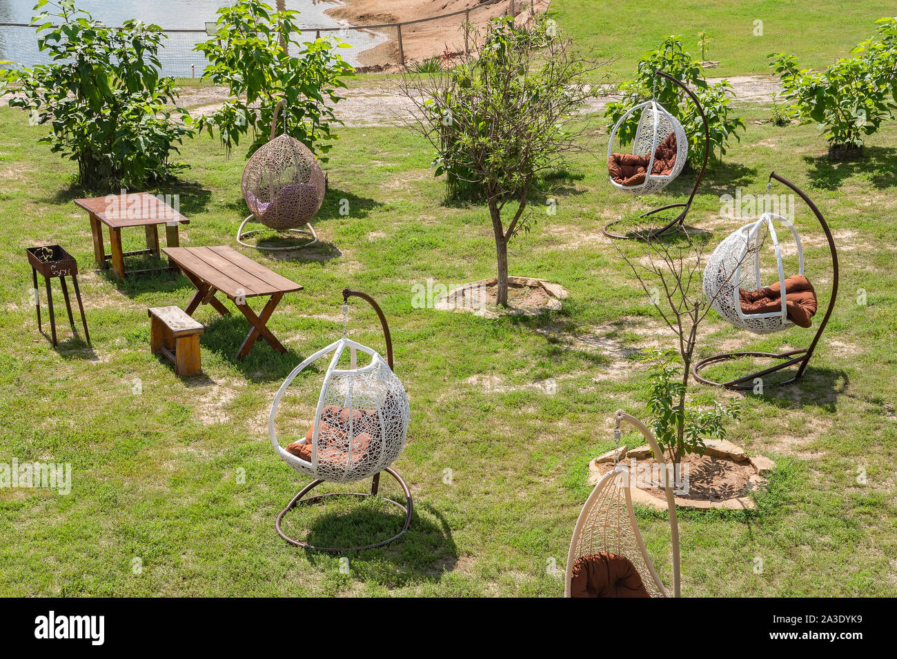 Relaxation zone on front yard, backyard. Comfortable wicker hanging ...