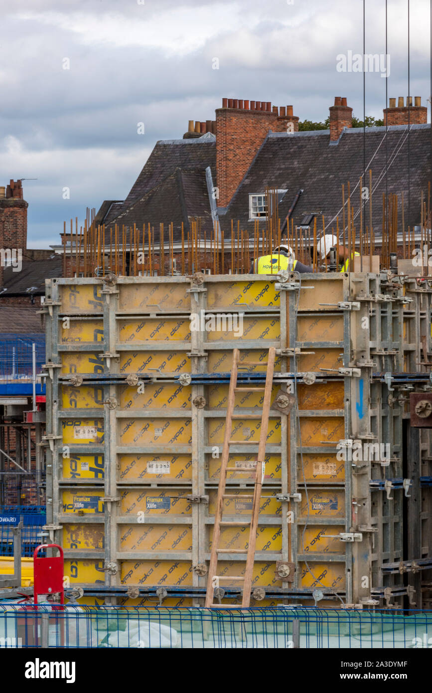 construction building workers working at height on a concrete ...