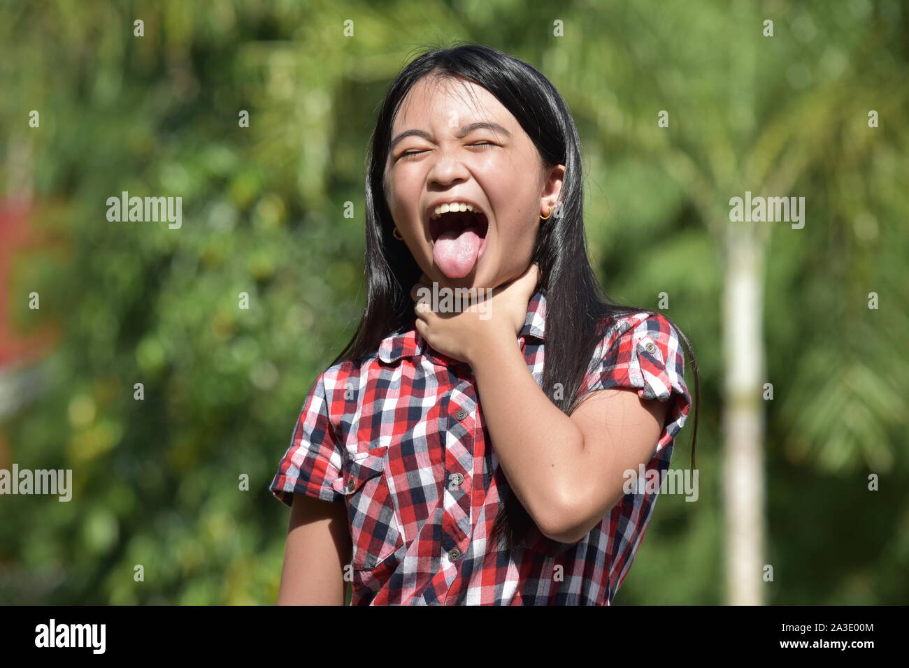 A Pretty Youth Choking Stock Photo - Alamy
