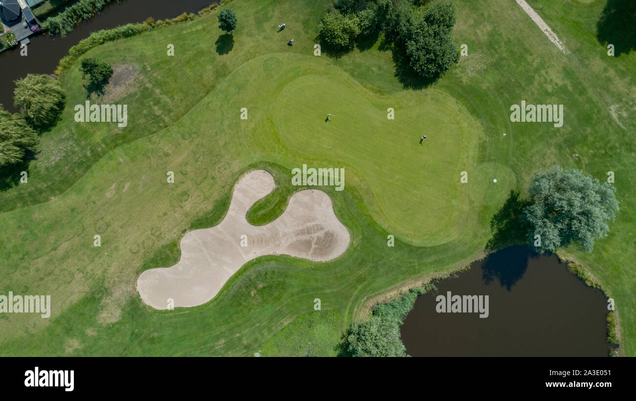 Aerial view from a Golf course with a rich green turf beautiful scenery ...