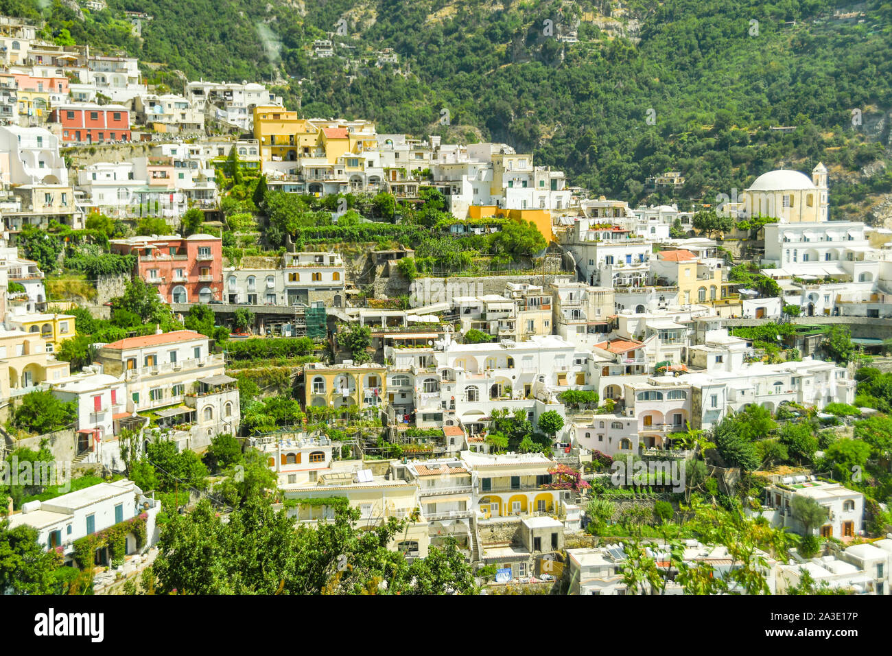POSITANO, ITALY - AUGUST 2019: Scenic view of homes set into the steep ...