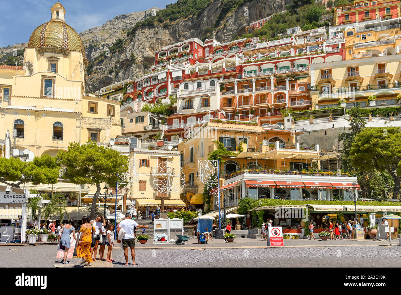 POSITANO, ITALY - AUGUST 2019: People on the seafront in Positano. It ...
