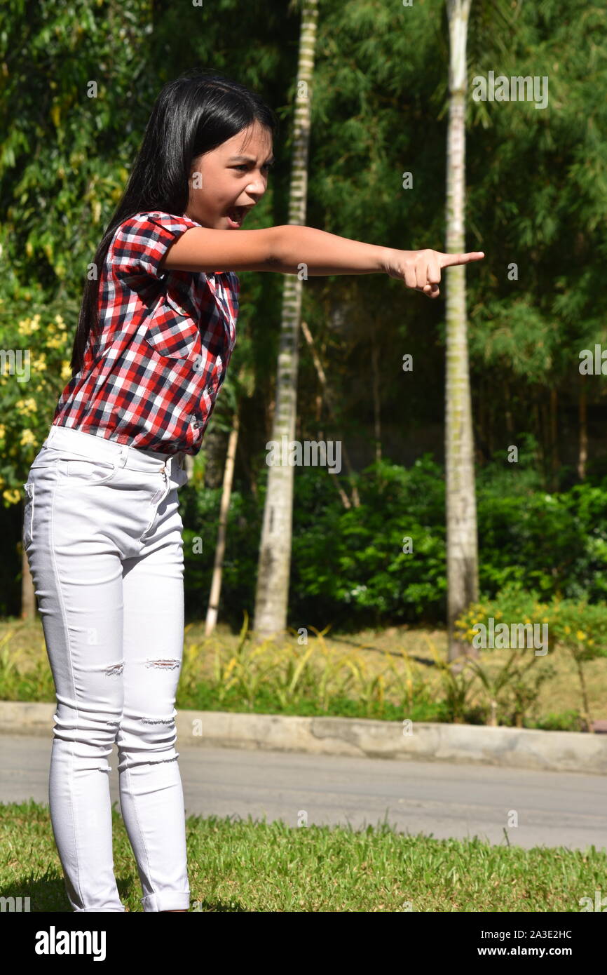A Pointing Asian Girl Stock Photo - Alamy