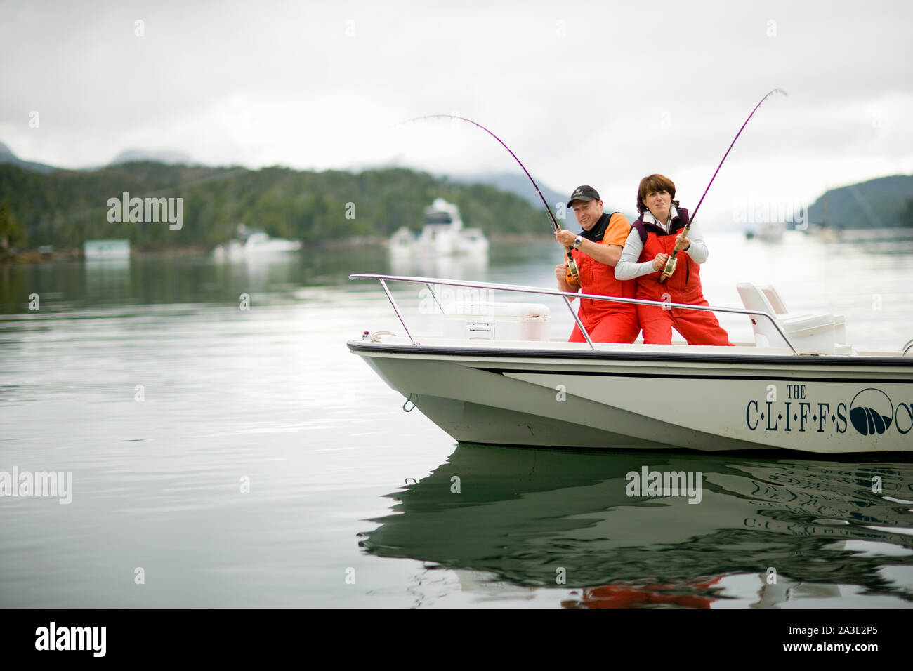 Couple catching fish hi-res stock photography and images - Alamy