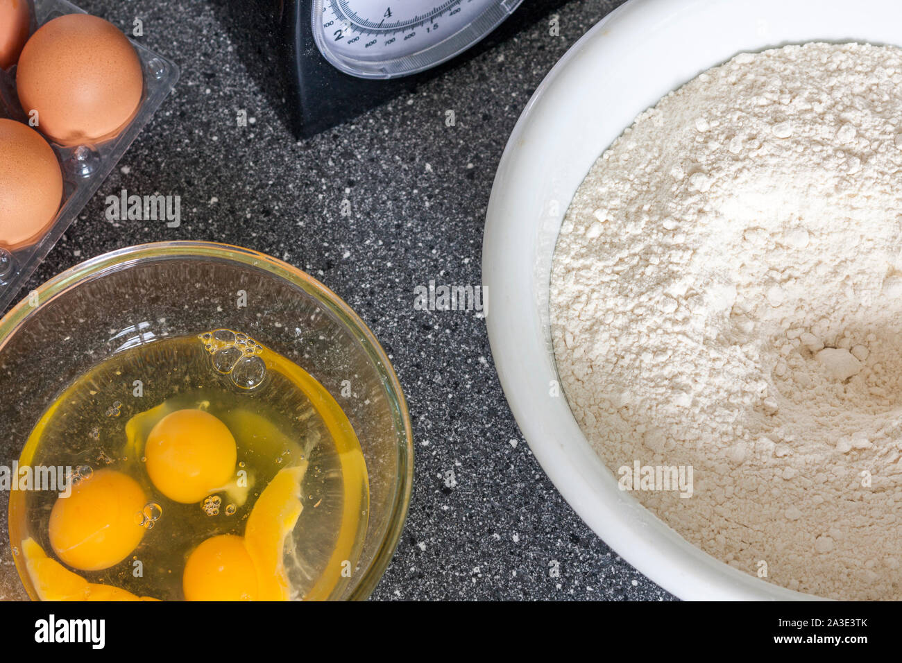 Overhead view of eggs and flour, ingredients for fresh pasta Stock ...