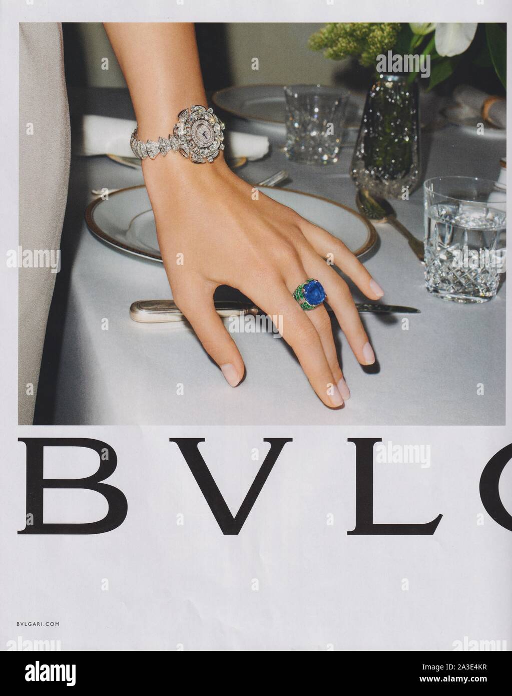 poster advertising BVLGARI fashion house with Carla Bruni in paper ...