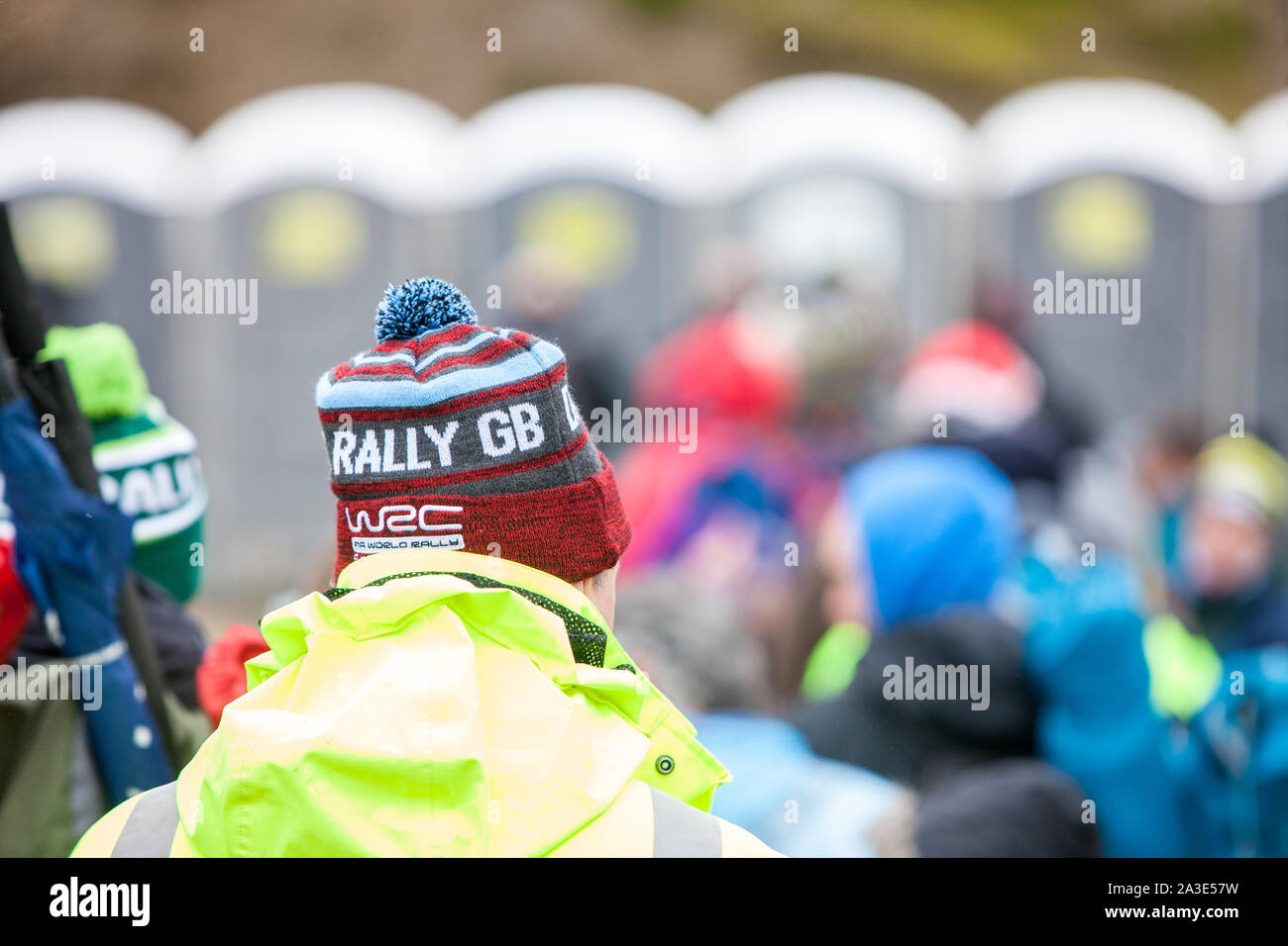 On,a,wet,rainy,day,Standing,waiting,in,line,Q,Queue,to,use,portable ...