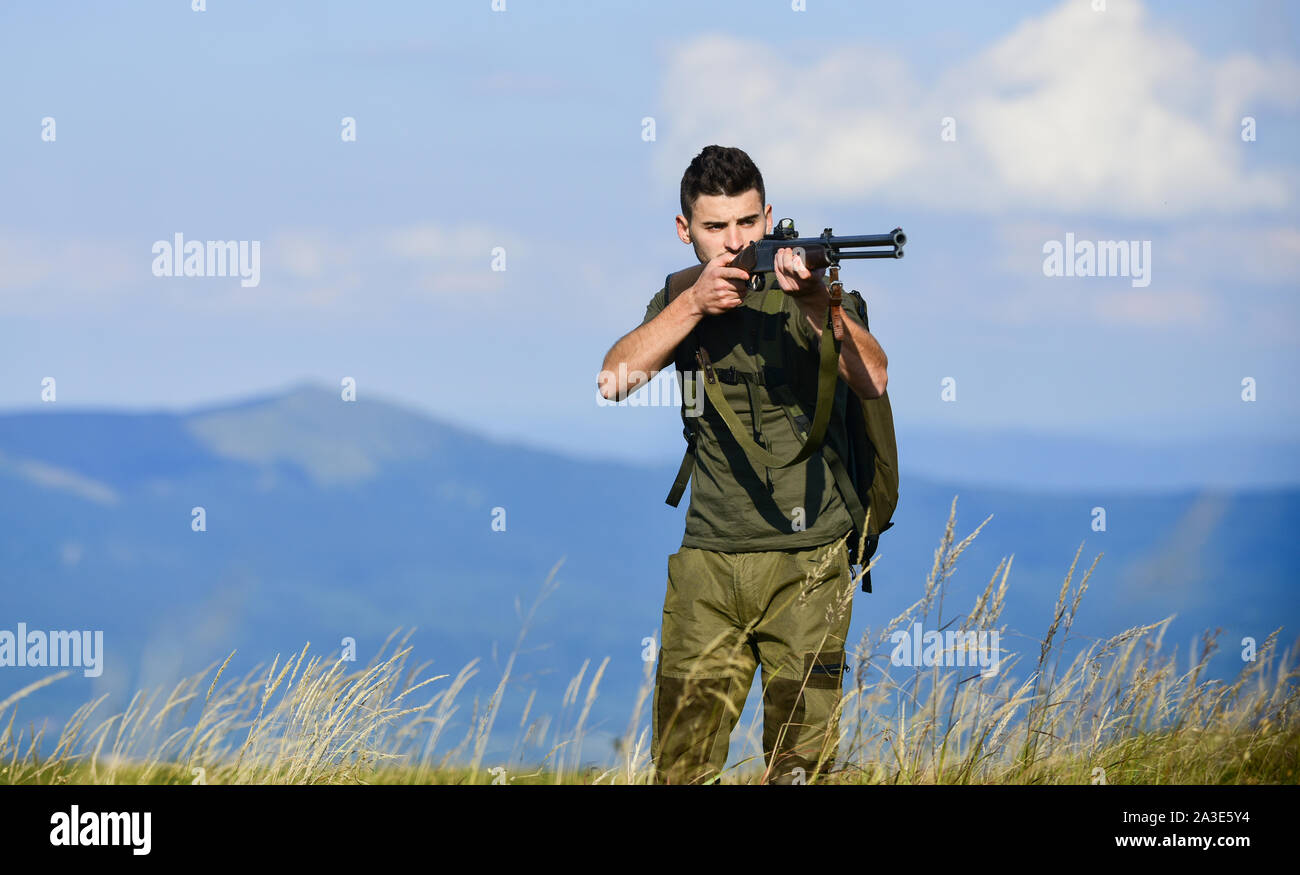 soldier in the field. polygon. muscular man hold weapon. purpose and ...