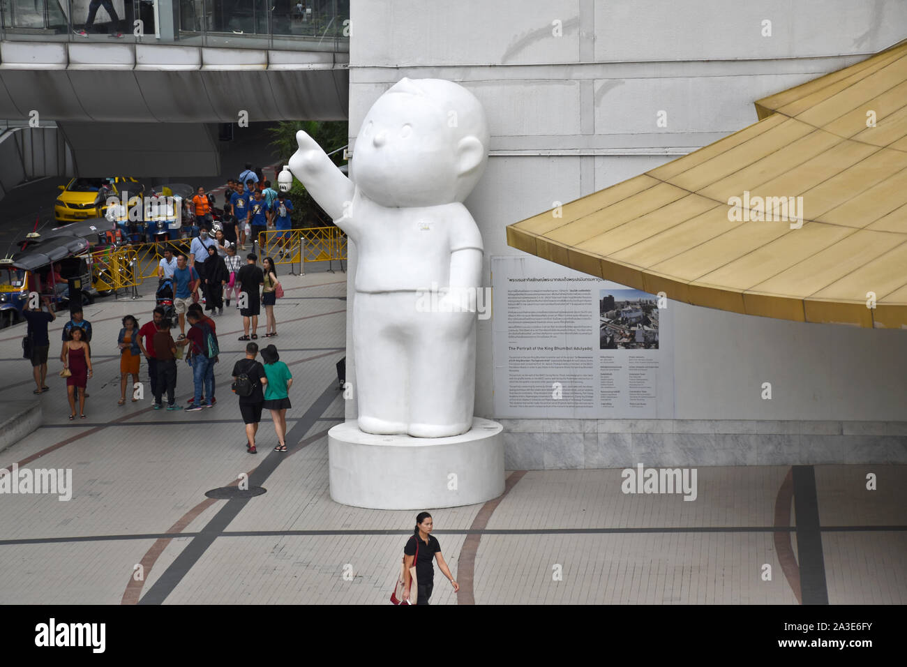 Bangkok, Thailand 08.23.2019: A giant white colored boy statue points ...