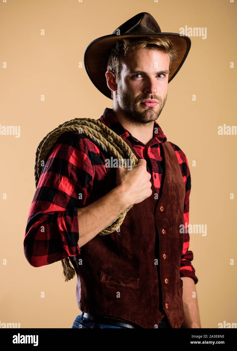 real man. Vintage style man. Wild West retro cowboy. cowboy with lasso ...