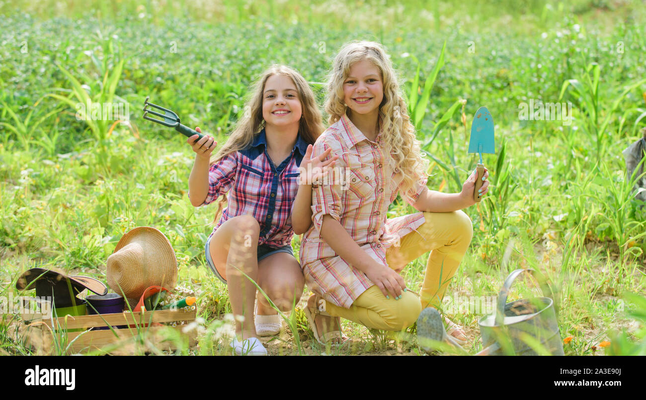 Planting and watering. Rustic children working in garden. Agriculture ...