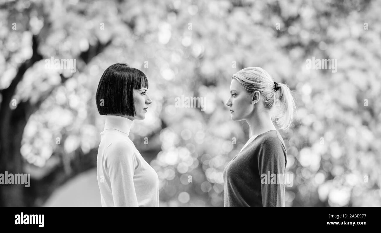 Pretty girls friends sisters. Eye contact. Women looking at each other ...