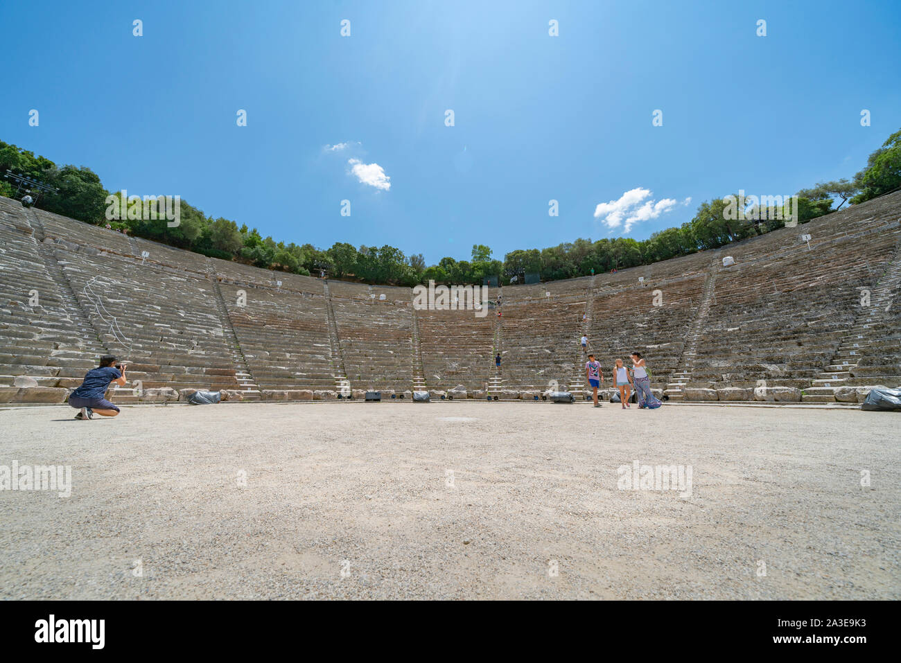 EPIDAURUS GREECE - JULY 19 2019; Tourists having photo taken on floor ...