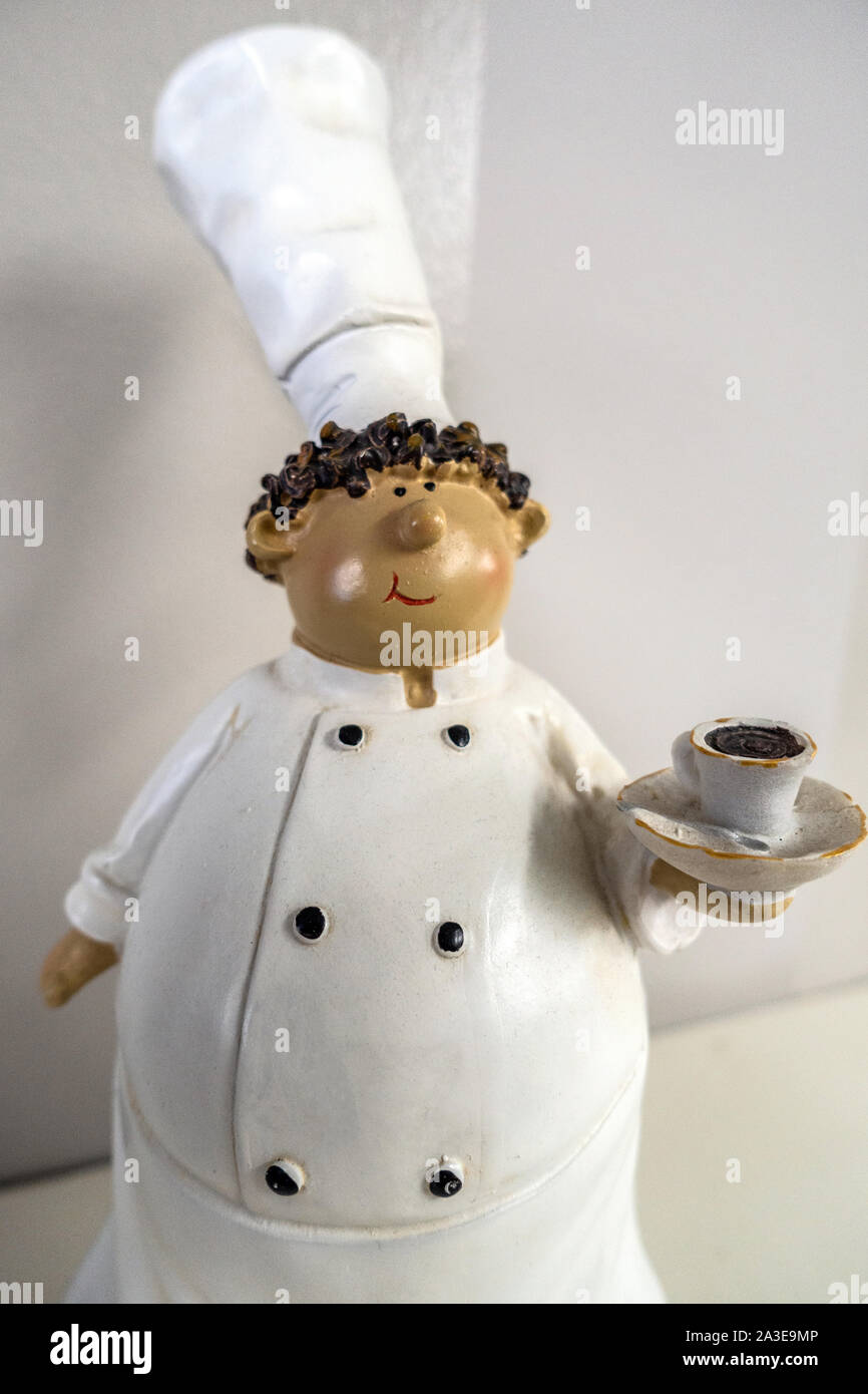 Pottery figure of a chef in whites Stock Photo - Alamy