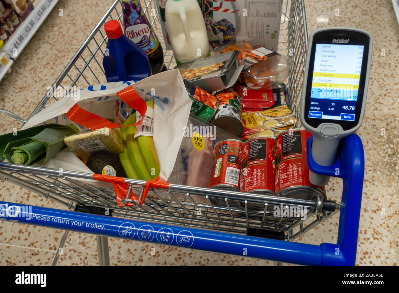 Food in supermarket shopping trolly with Scan as you shop handset Stock ...