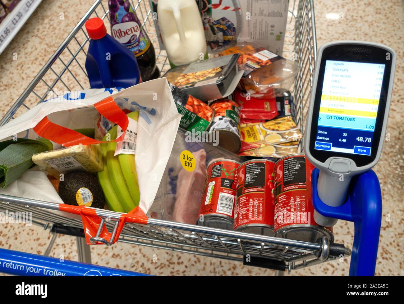 Food in supermarket shopping trolly with Scan as you shop handset Stock ...