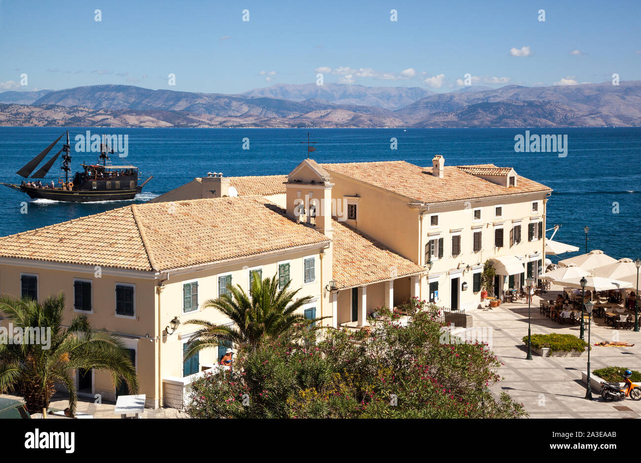 View of a taverna and restaurant at the port harbour area of Corfu town ...