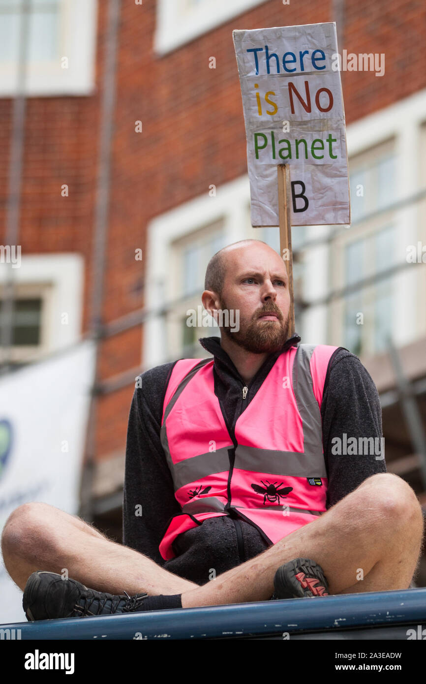 London, UK. 7 October, 2019. A climate activist from Extinction ...