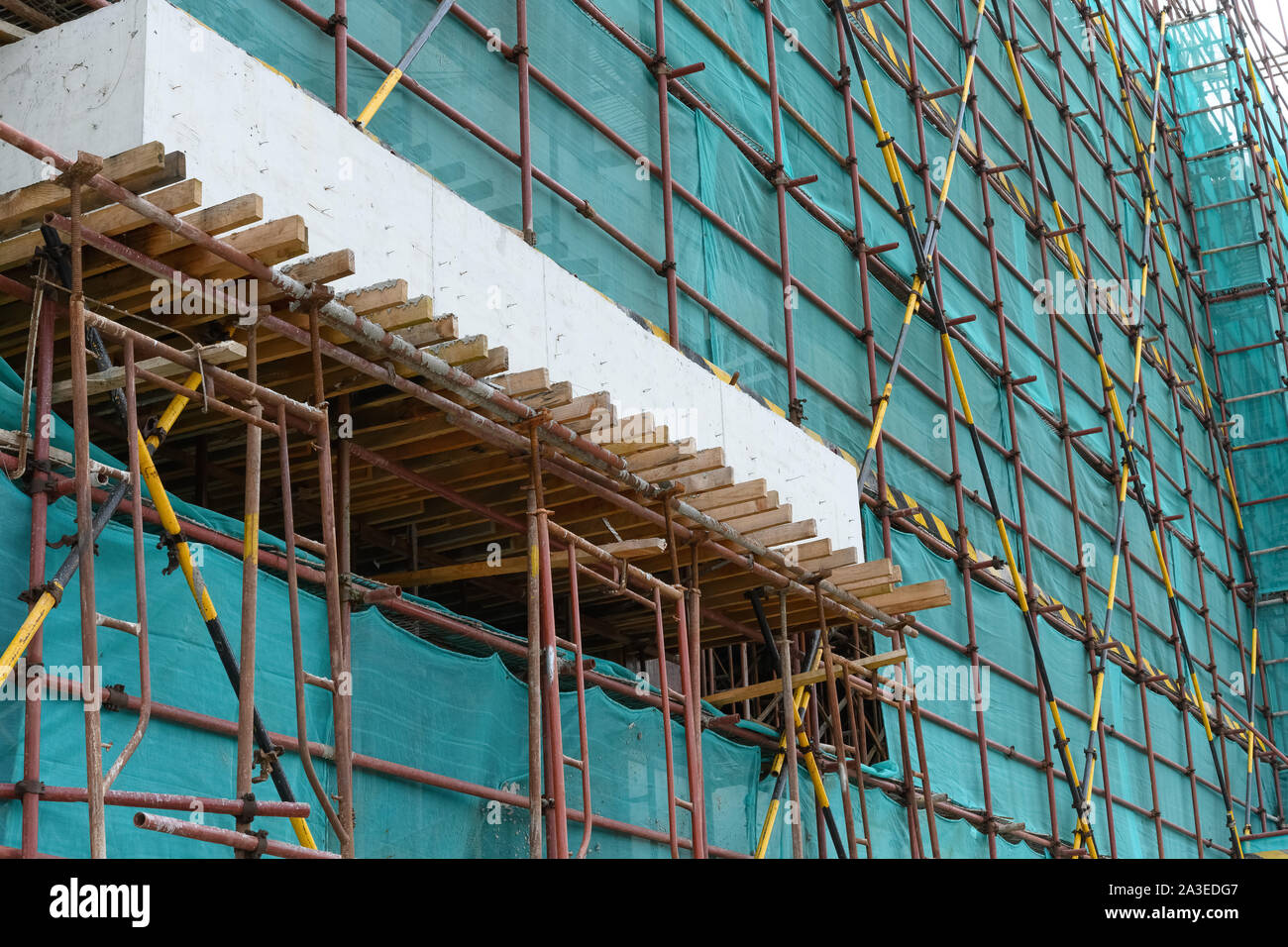 scaffolding and protection netting on an unfinished building Stock ...