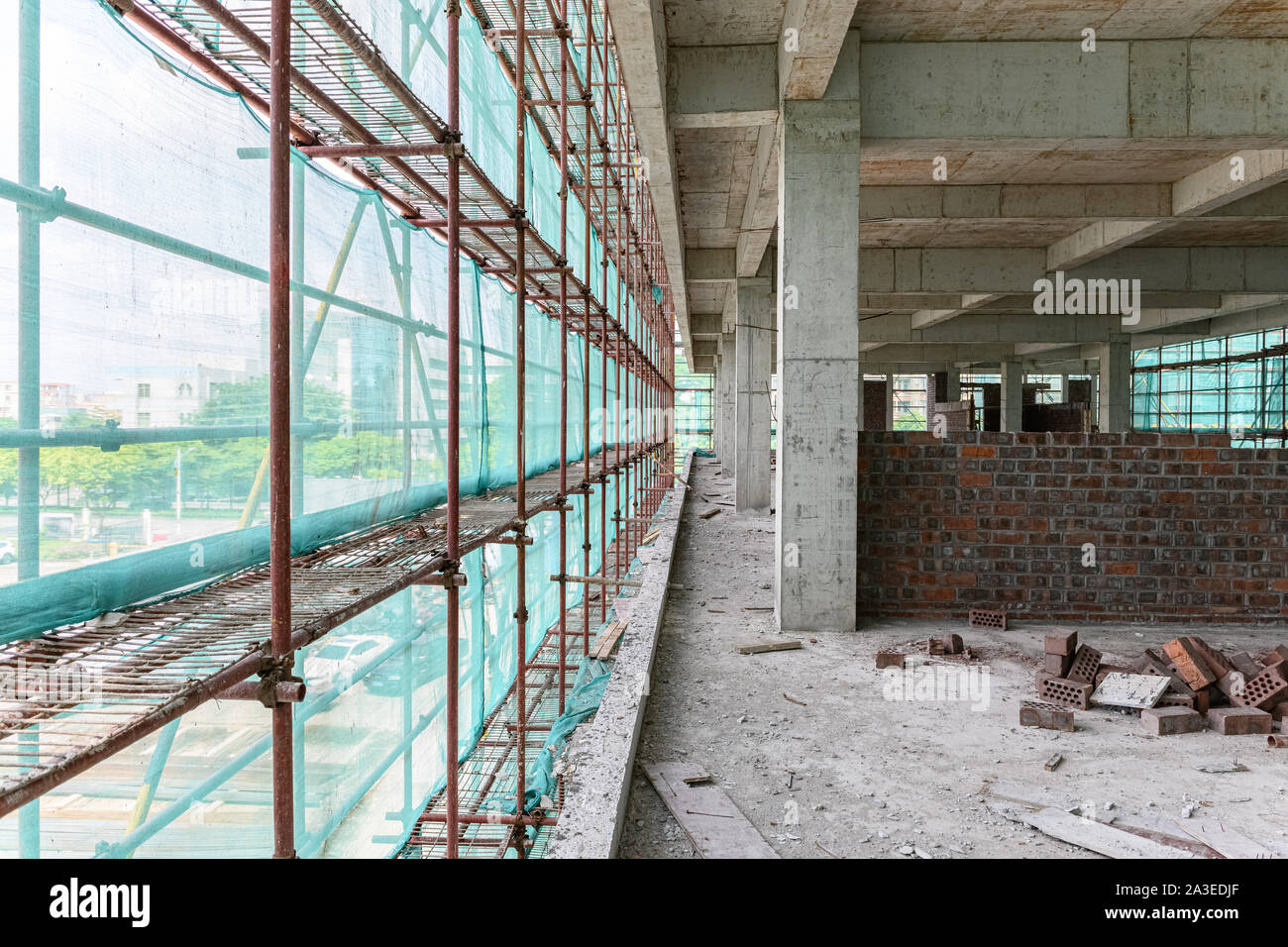 inside of an unfinished building with protection scaffolding and ...
