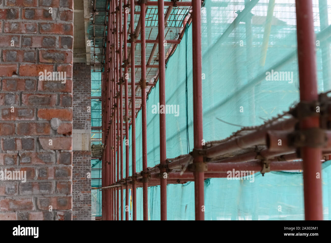inside of an unfinished building with protection scaffolding and ...