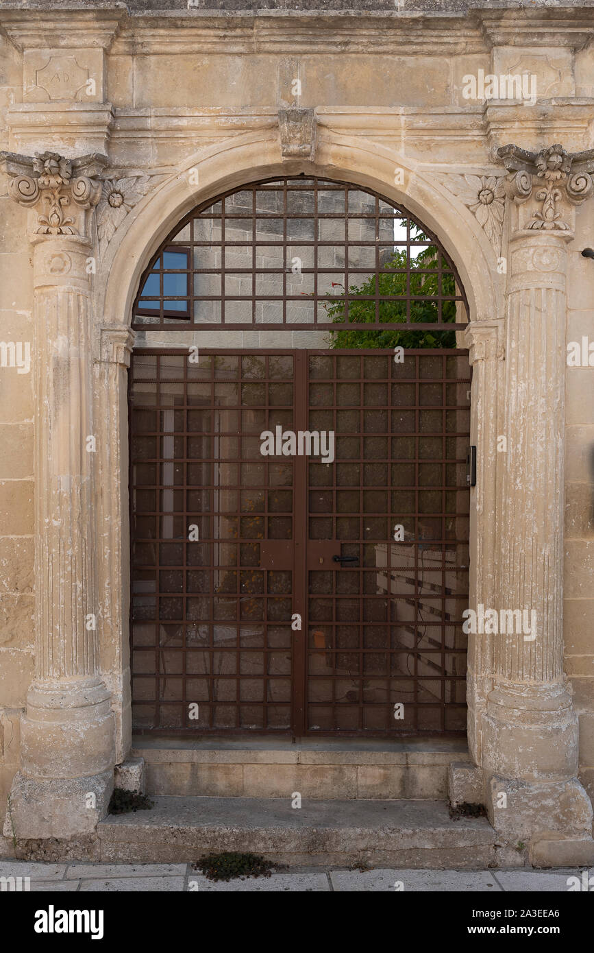 Castrigliano, Puglia, Italy. View of the baroque gate with a wrought ...