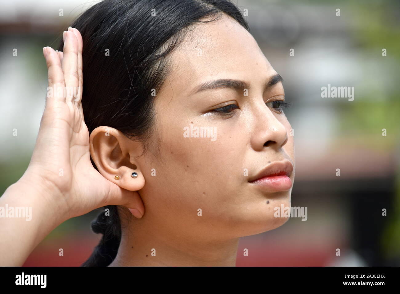 An Adult Female Listening Stock Photo - Alamy