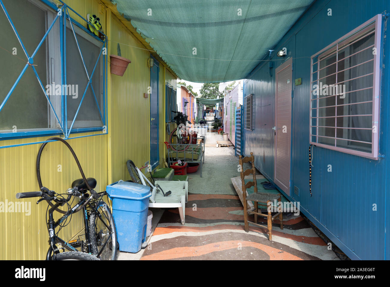 Brightly painted isoboxes are seen on a typical street in Camp Eleonas ...