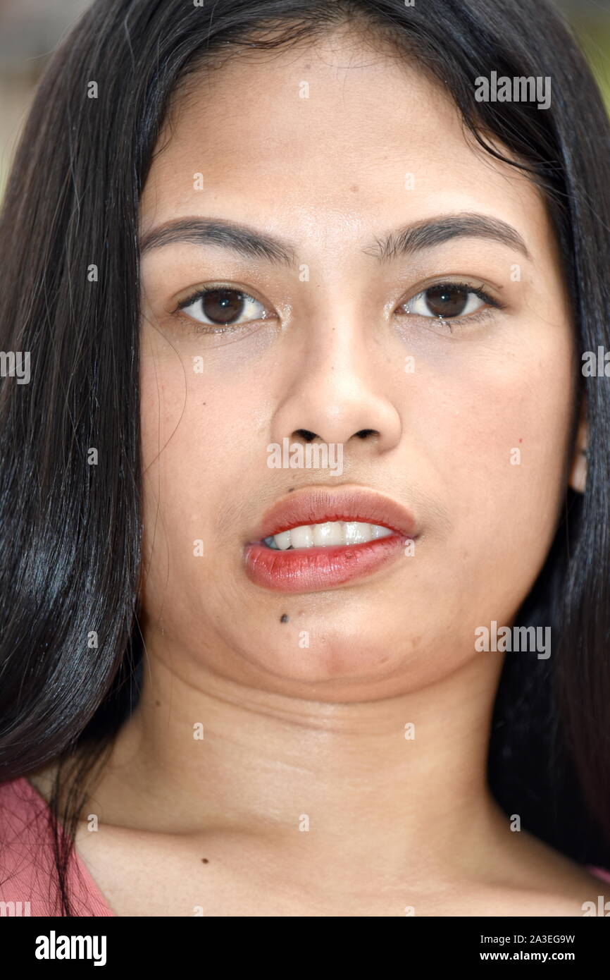Beautiful woman smirking hi-res stock photography and images - Alamy