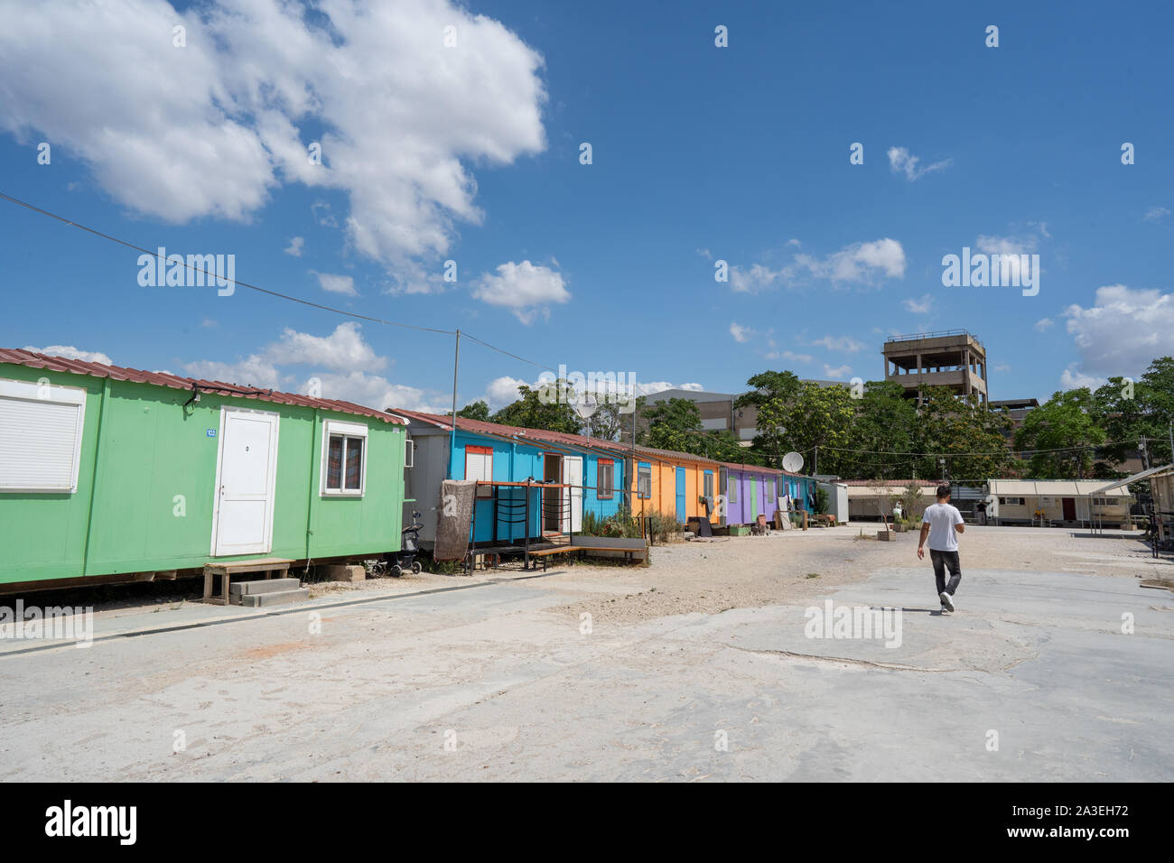 Brightly painted isoboxes are seen in Camp Eleonas. In 2018, there were ...