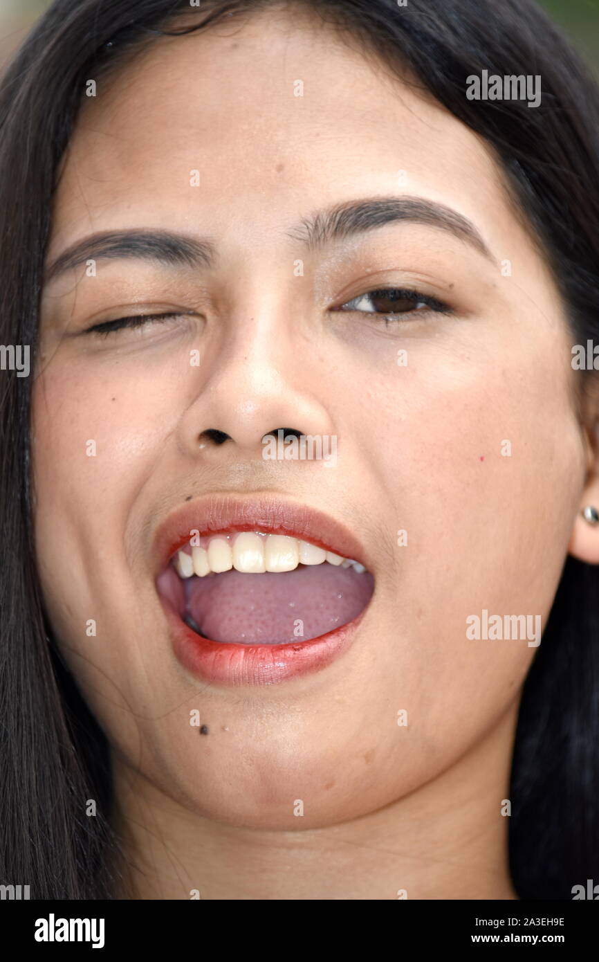 Attractive asian female winking hi-res stock photography and images - Alamy
