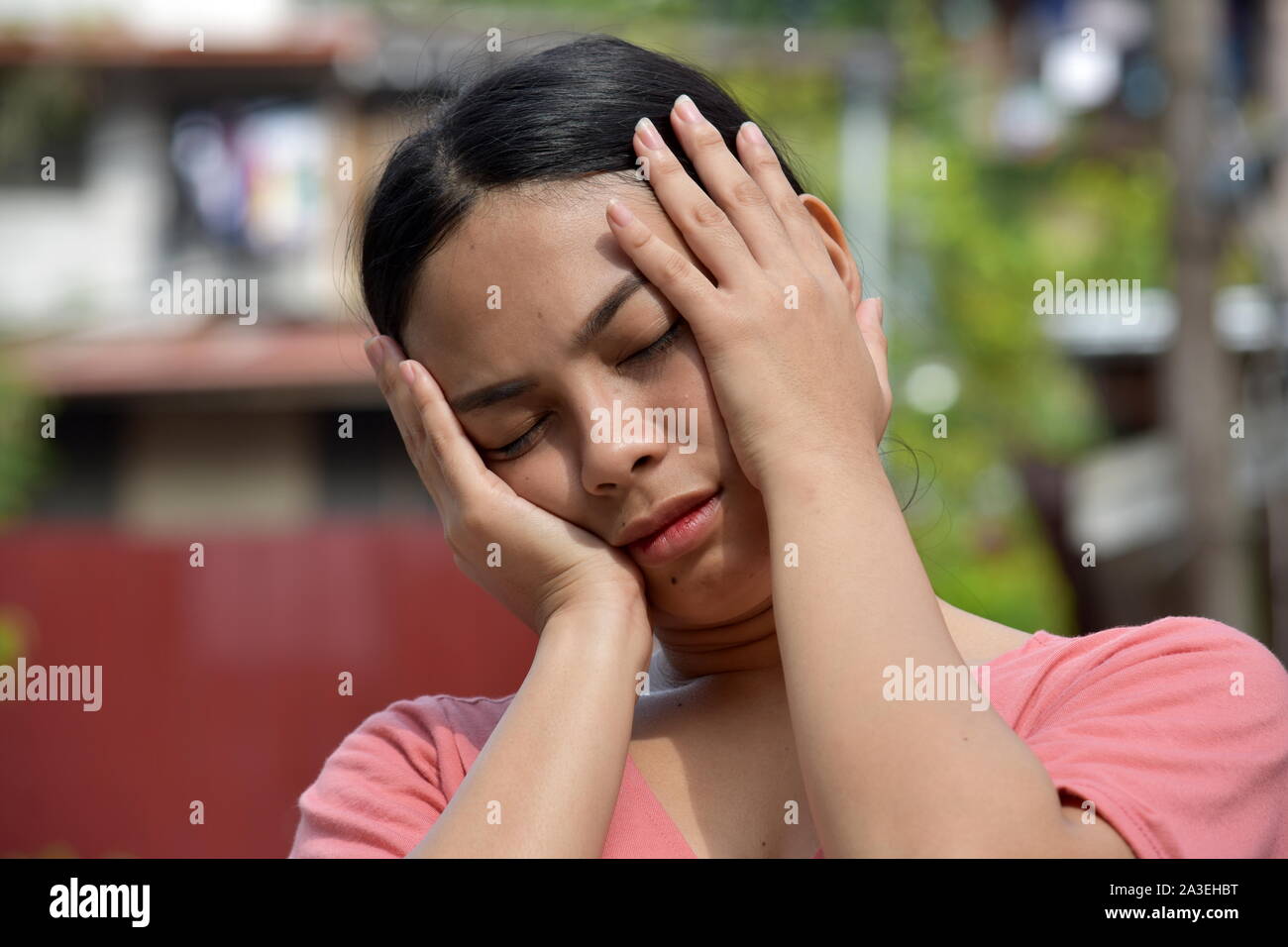 A Stressed Filipina Woman Stock Photo - Alamy