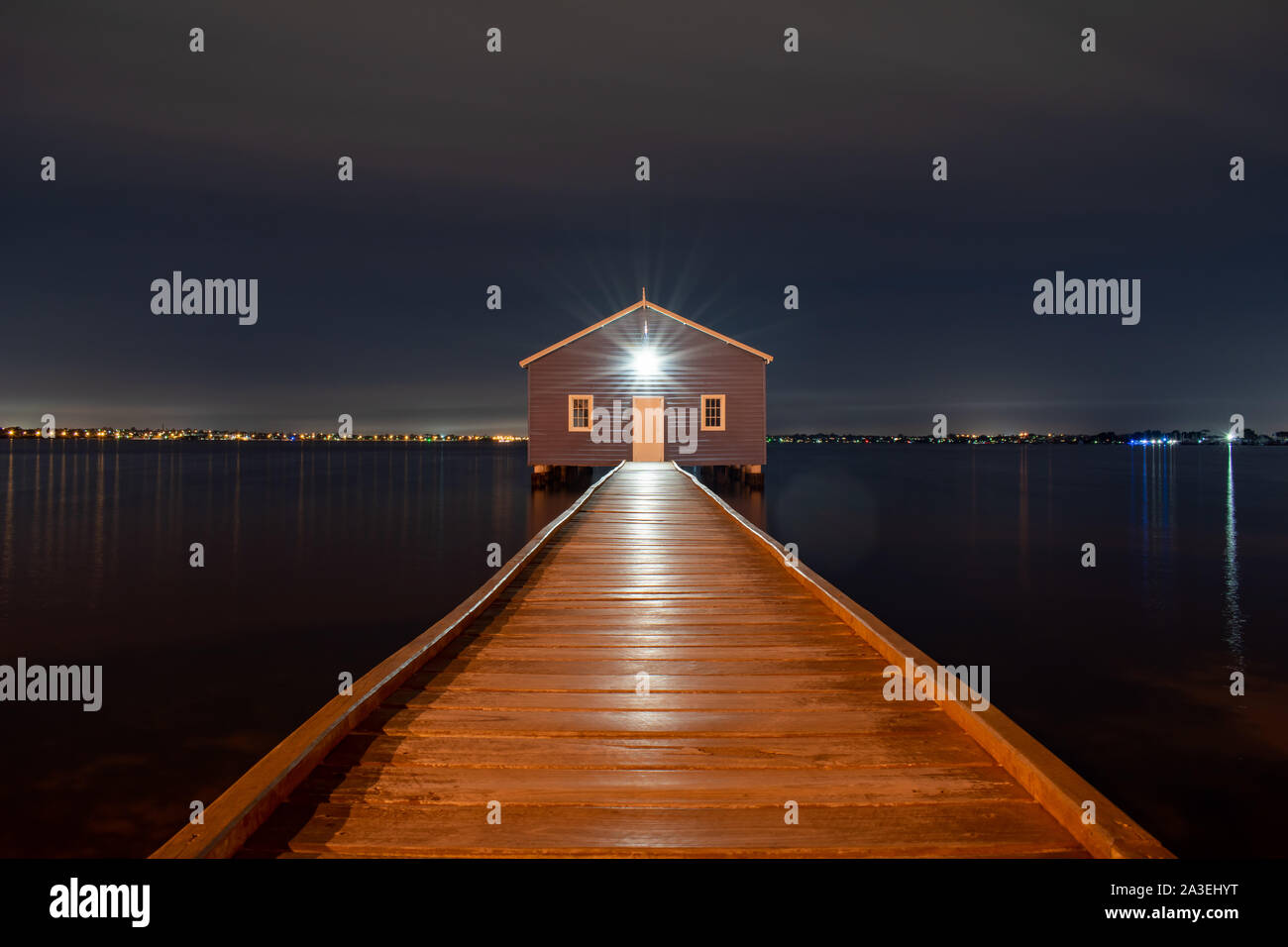 Boat shed house floating over the water at night Stock Photo - Alamy