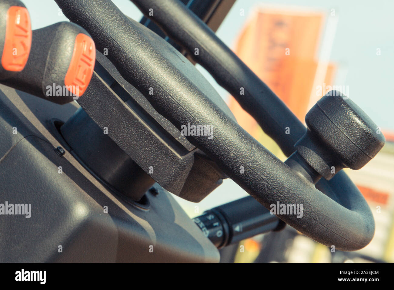 Operating control panels and steering wheel in loader machine or other ...