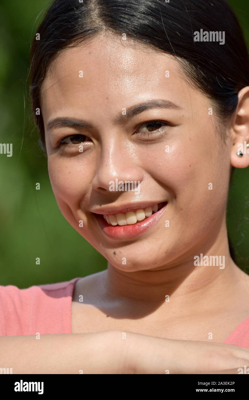 A Young Filipina Female Smiling Stock Photo - Alamy