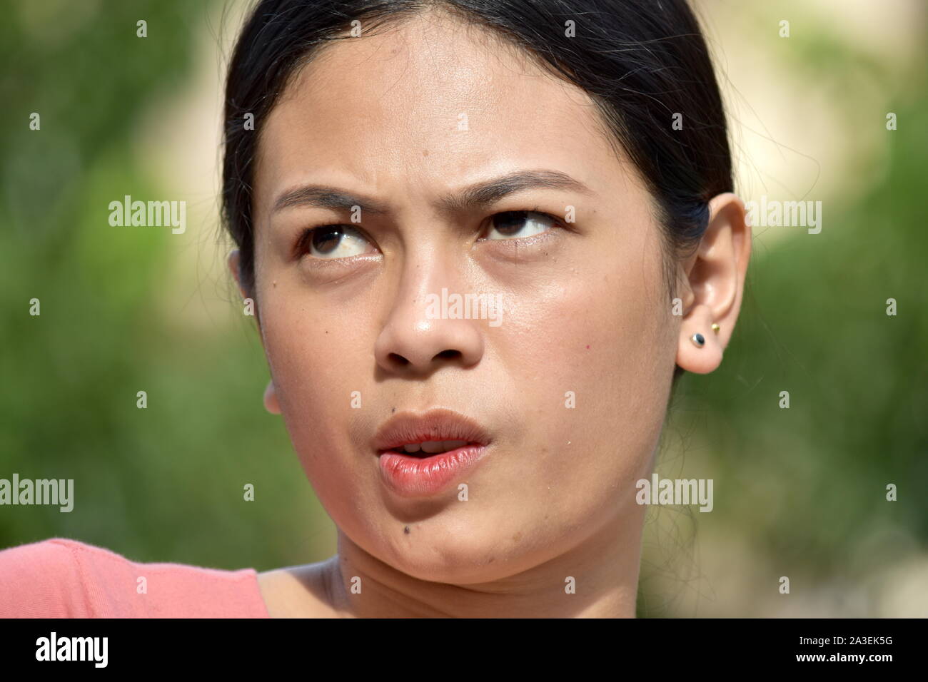 Pretty young confused woman hi-res stock photography and images - Alamy
