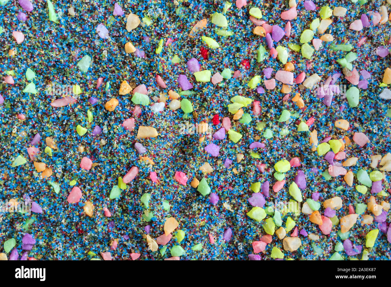 Top view with background of multi-colored small pebbles. Multi-colored ...