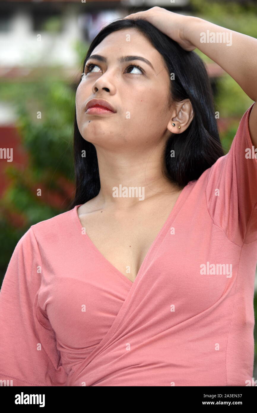 Serious asian woman thinking hi-res stock photography and images - Alamy