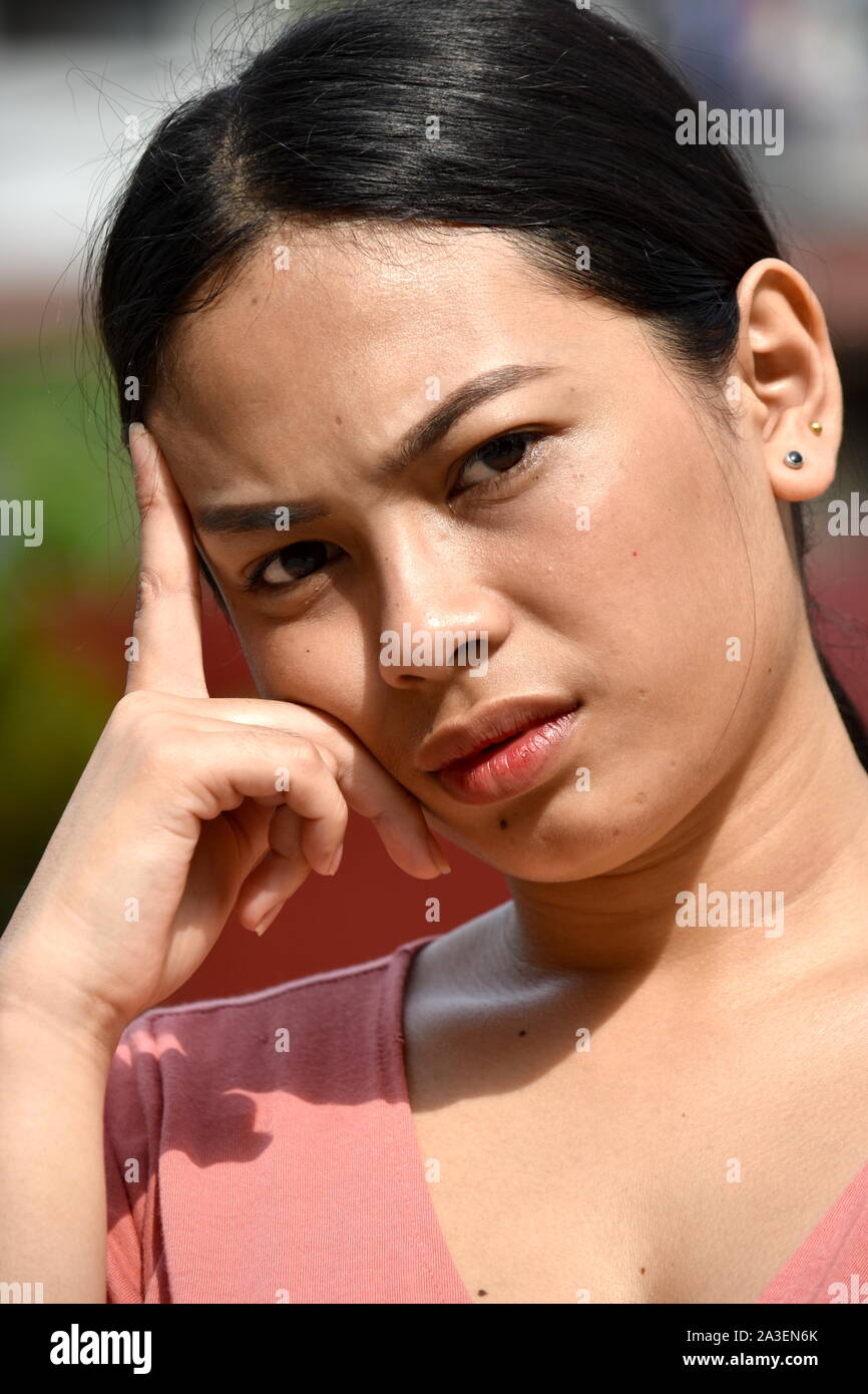 Serious asian woman thinking hi-res stock photography and images - Alamy