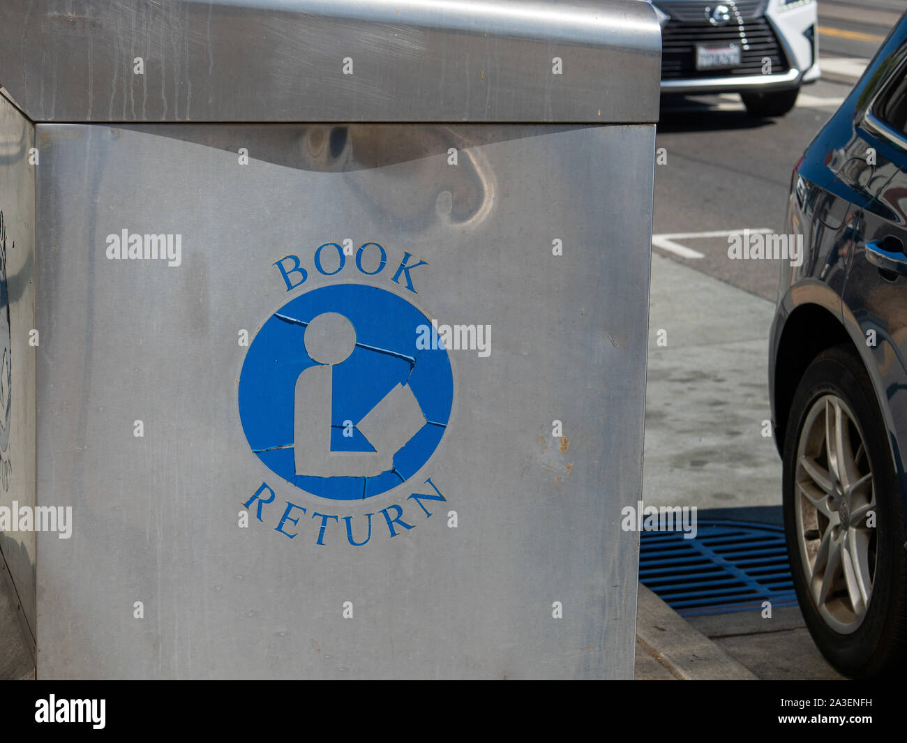 Book return symbol and label on outdoor book drop on street at library ...
