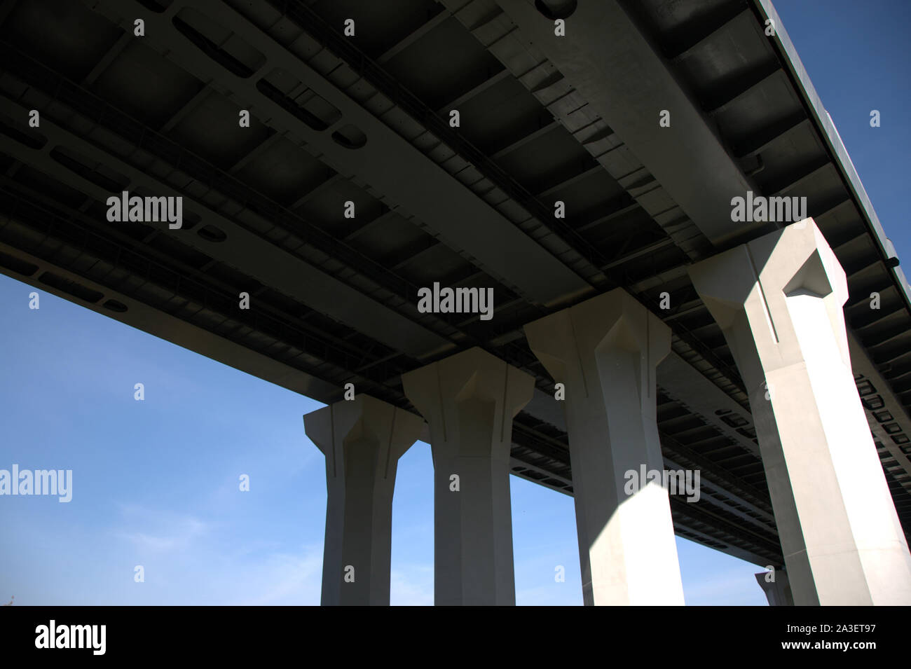 Four columned concrete bridge piers taken from a lower angle. Close-up ...