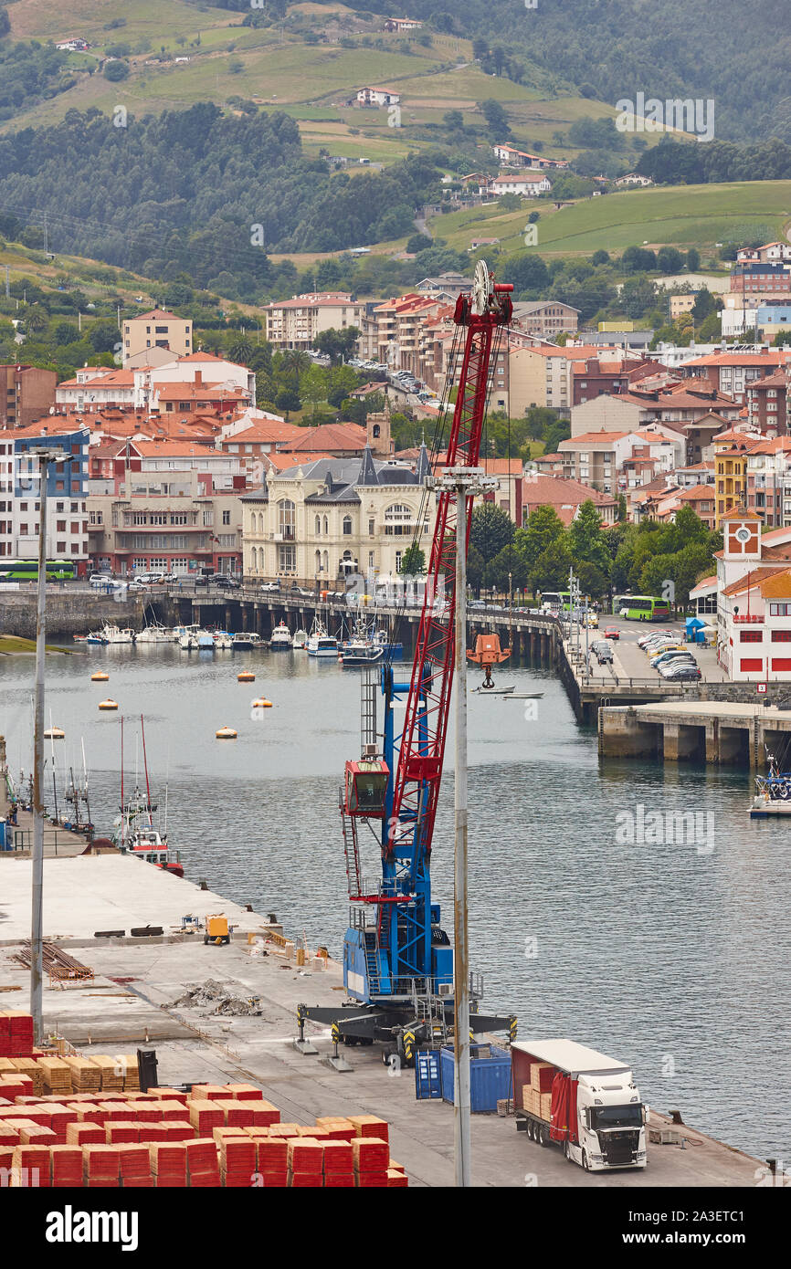 Bermeo commercial harbor and pier with crane. Basque country, Spain ...