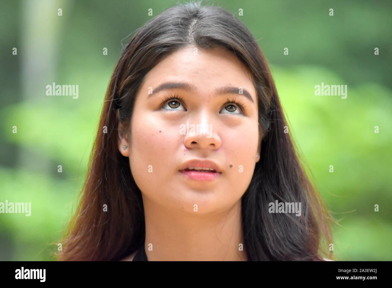An Uncaring Pretty Filipina Person Stock Photo - Alamy